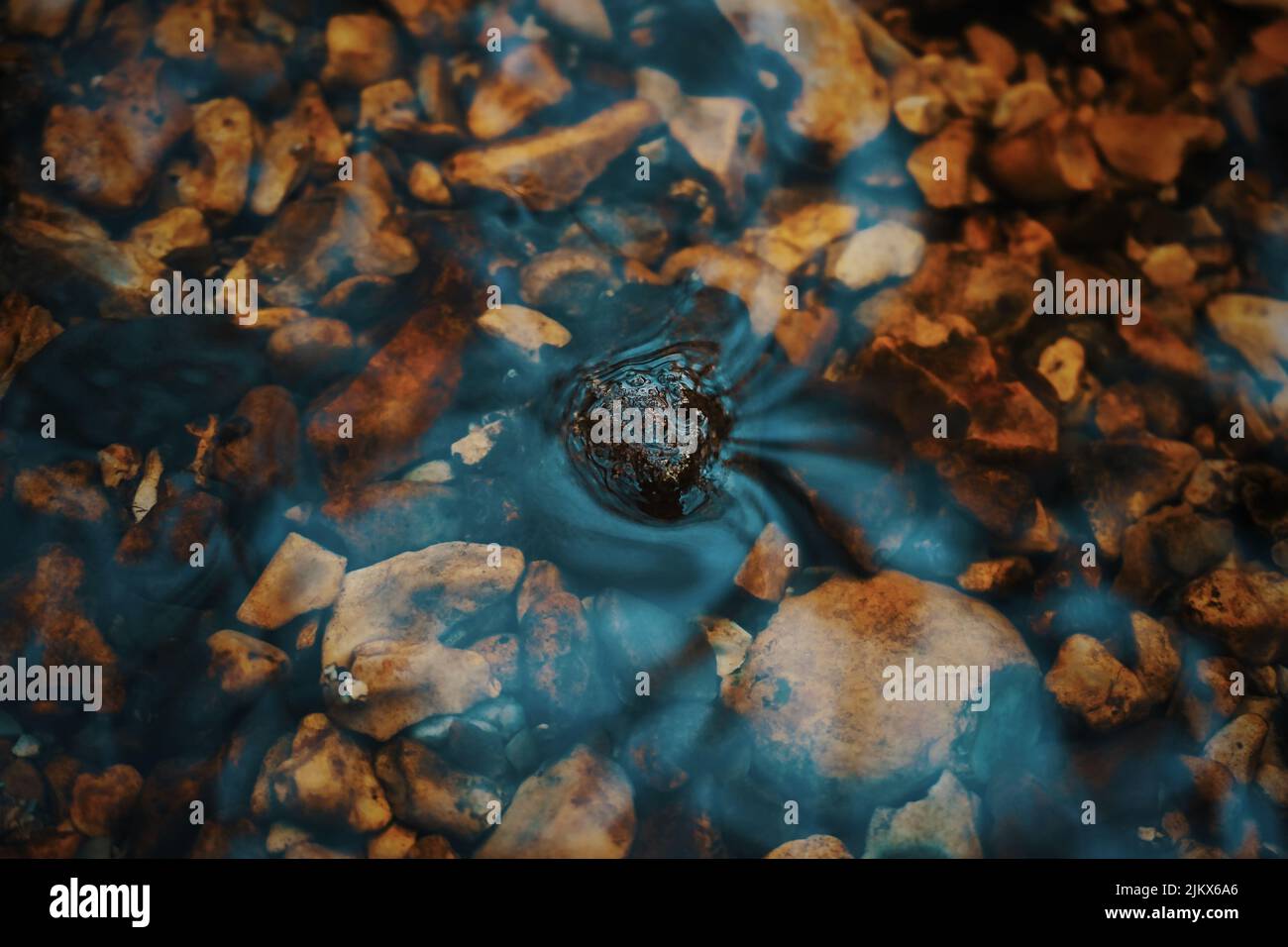 A top view of little stone in the river Stock Photo - Alamy