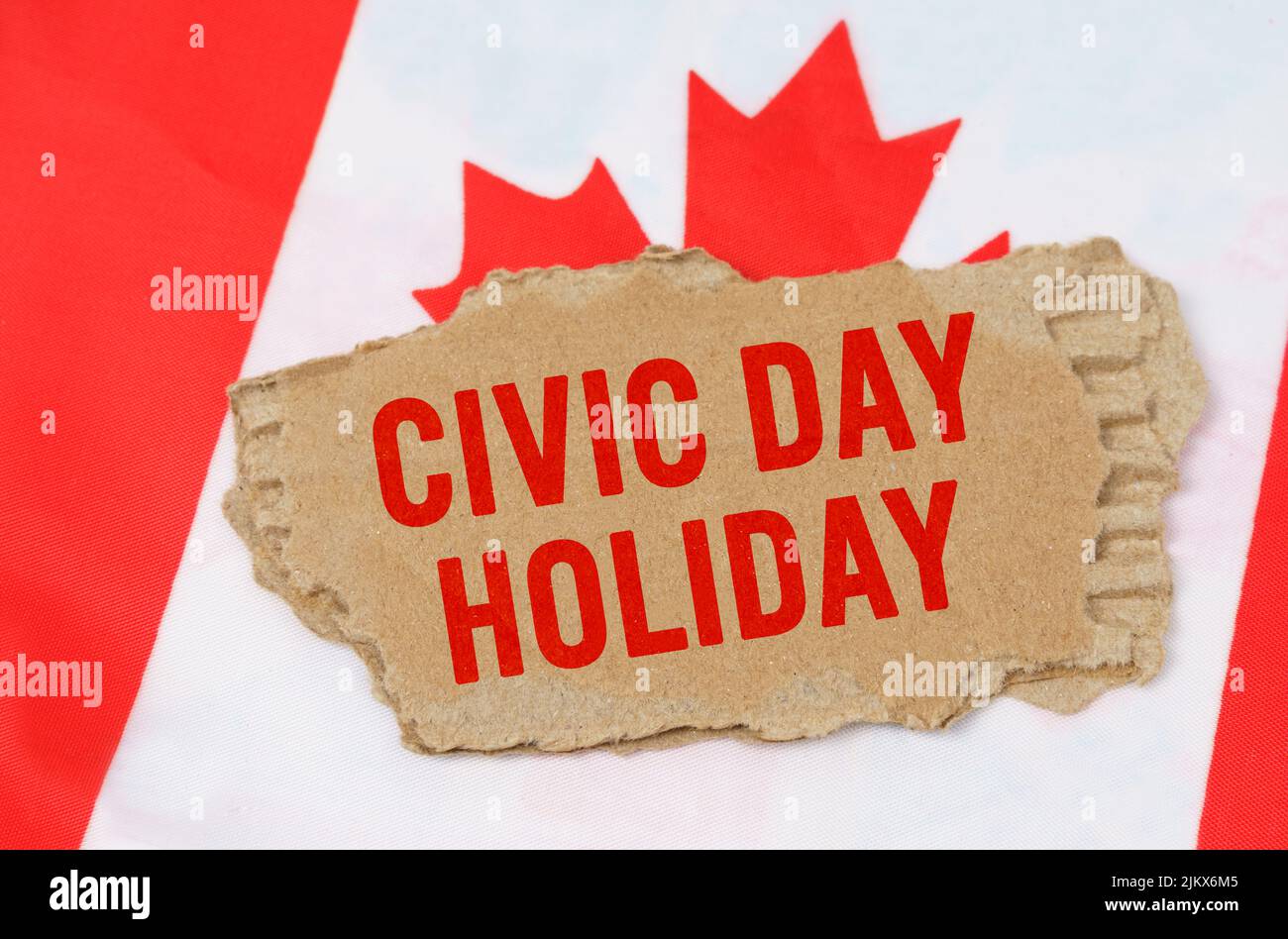 Holidays in Canada. Against the background of the flag of Canada lies ...