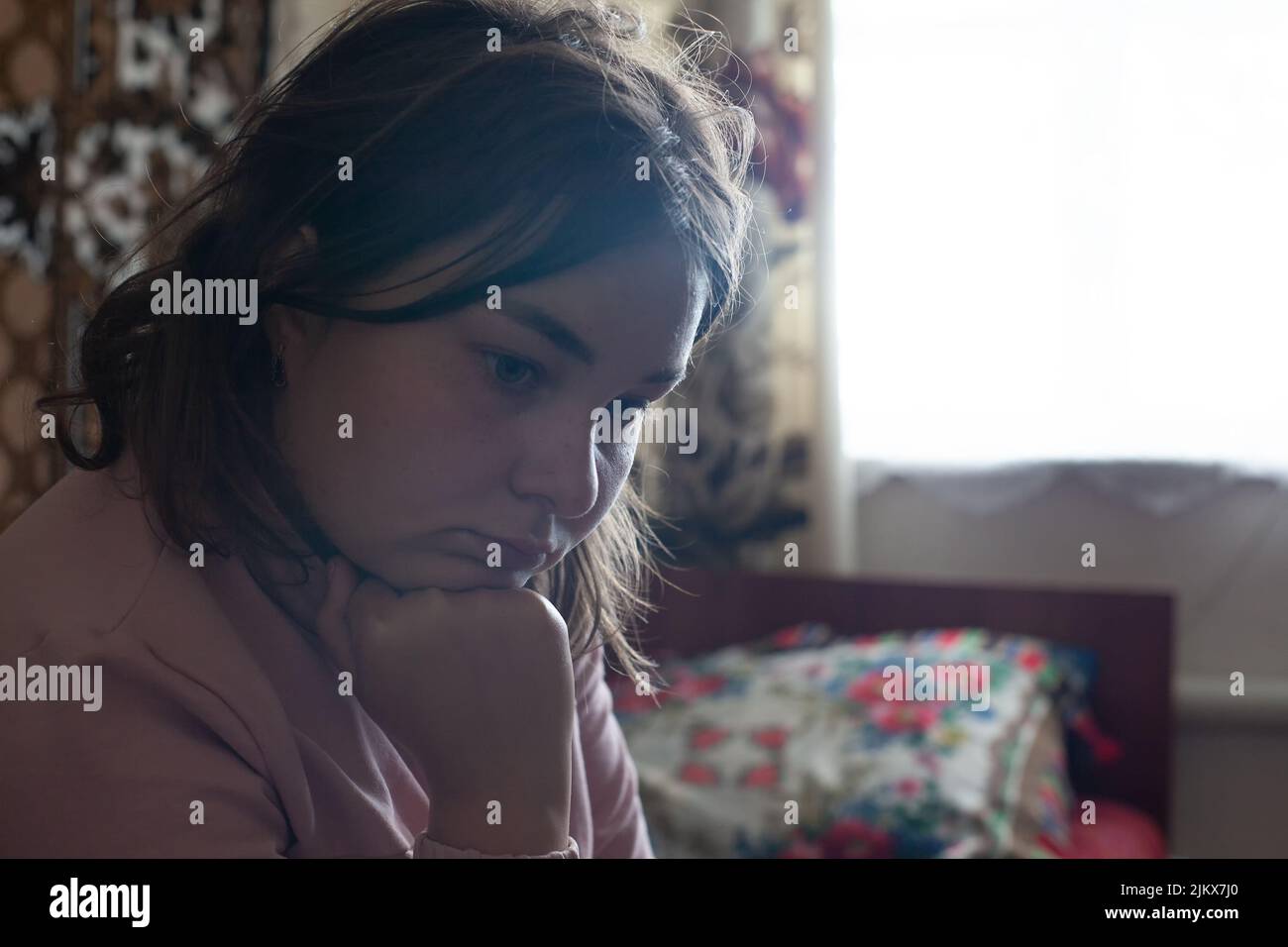 The girl thought and rested her hand on her chin. Sad girl Stock Photo ...