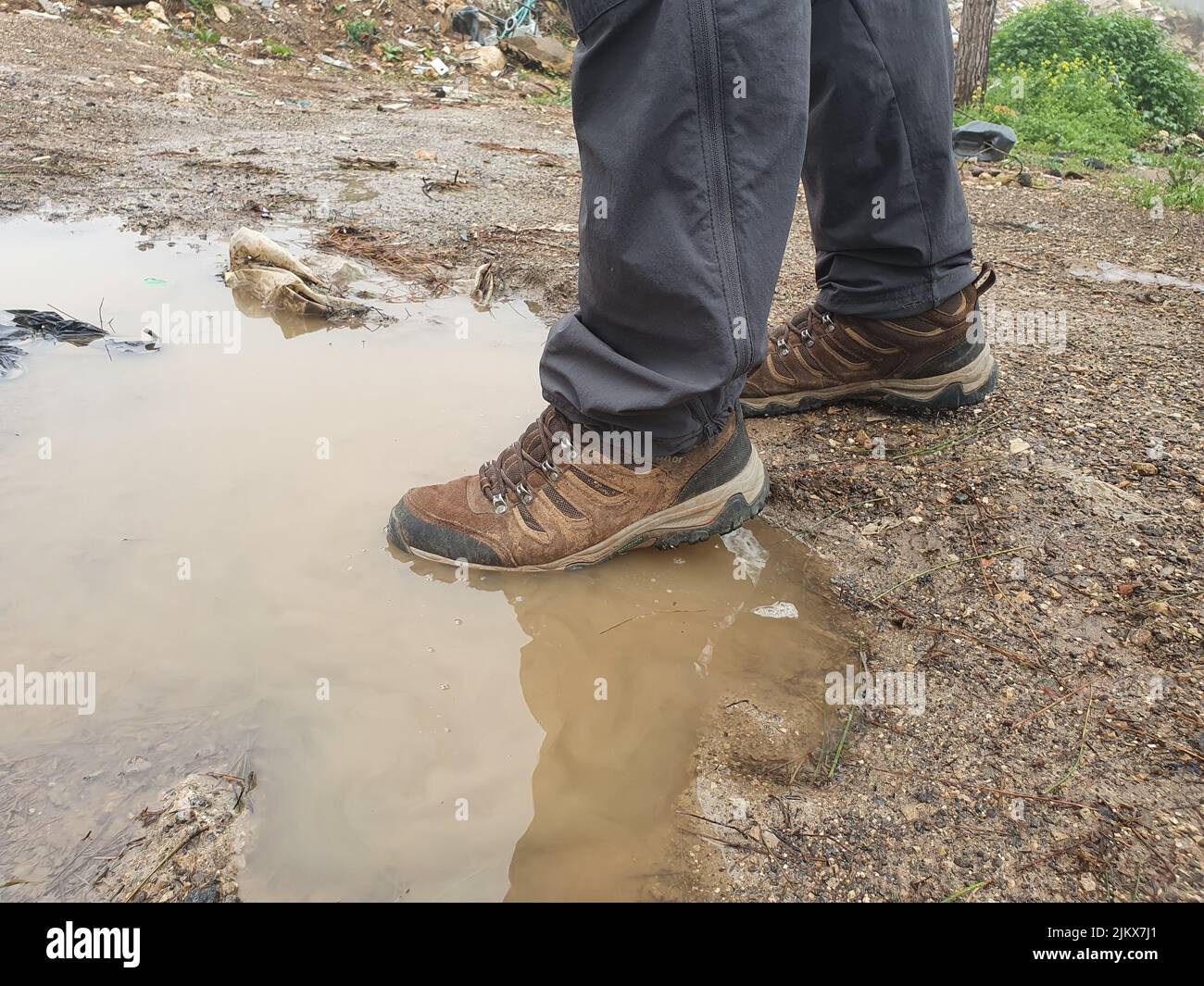 A close-up of man's foot in puddle Stock Photo - Alamy