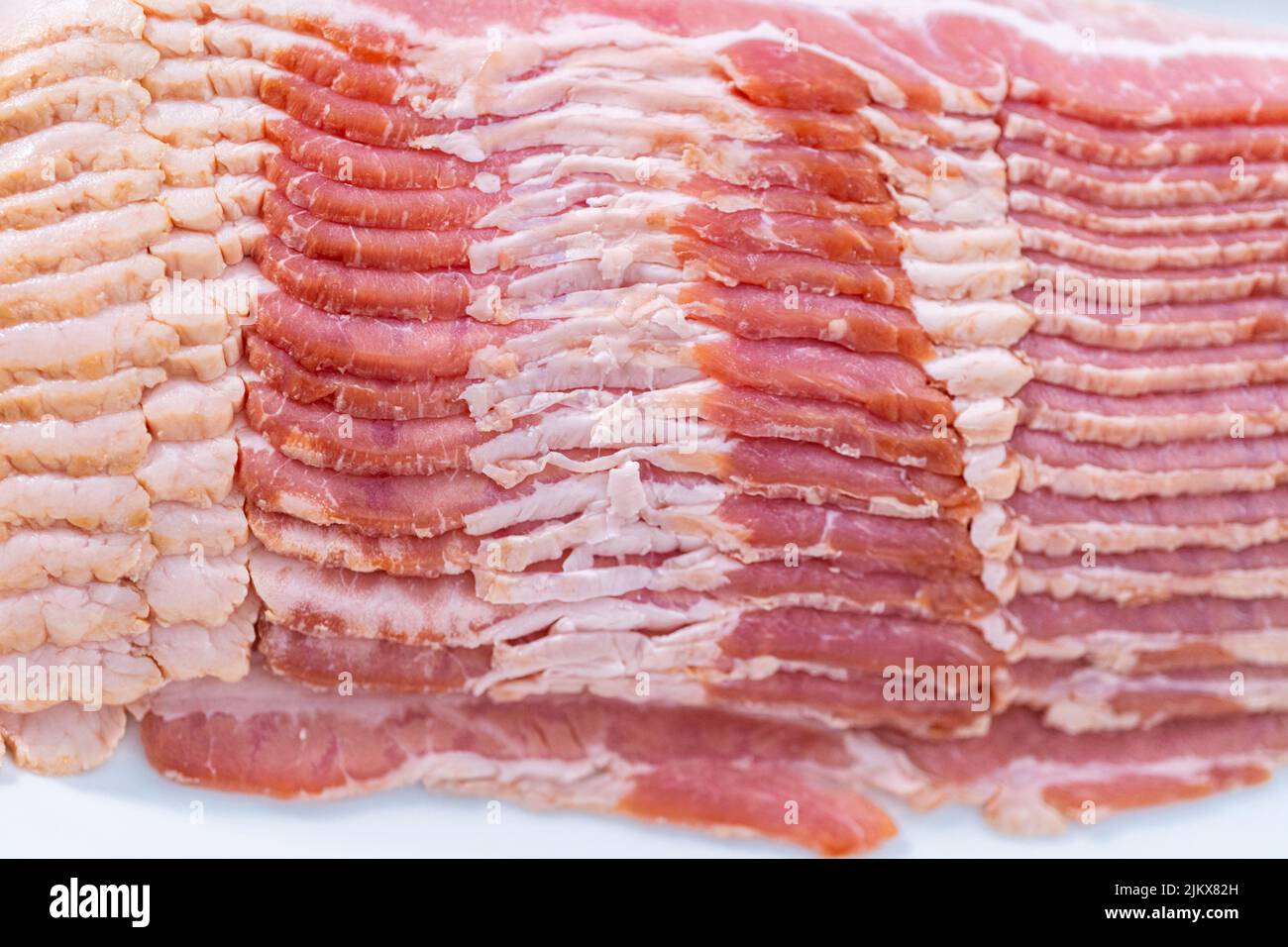 Cooking bacon strips Stock Photo - Alamy