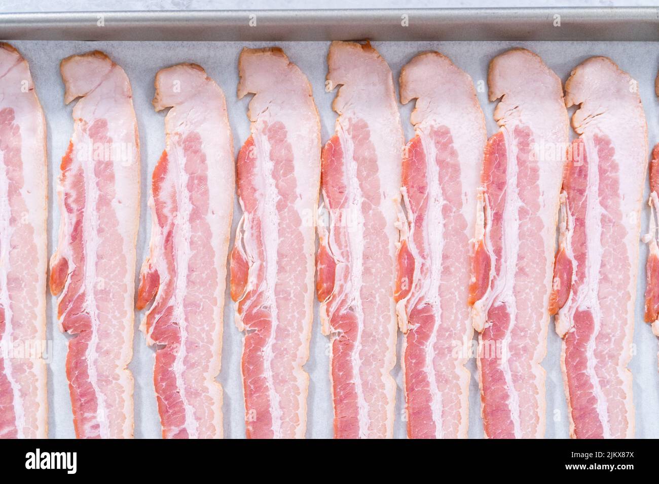 Cooking bacon strips Stock Photo - Alamy