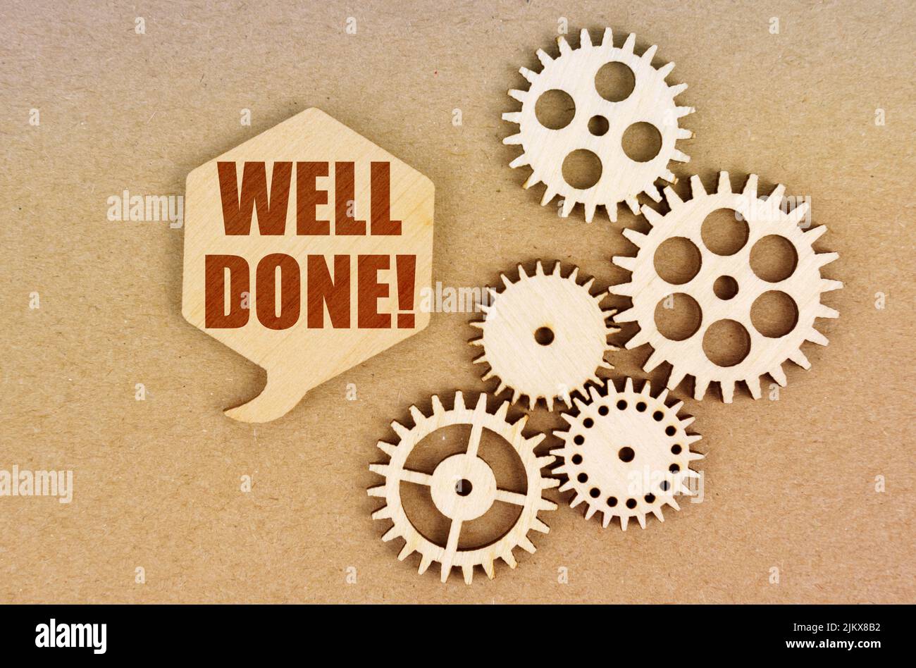 Business and economics concept. On a paper background, gears and a ...