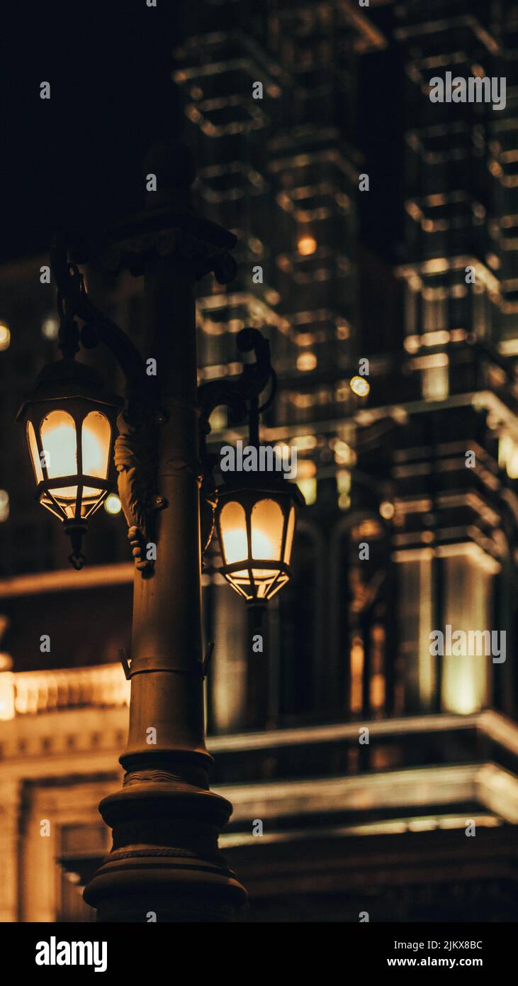 A vertical low angle of lanterns illuminating the street at night ...