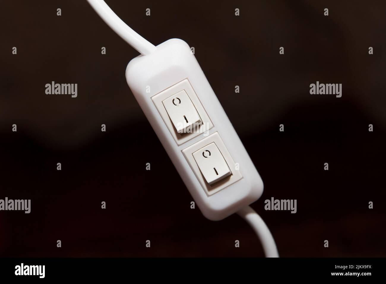 New double plastic switch for desk lamp connected to wire on dark ...