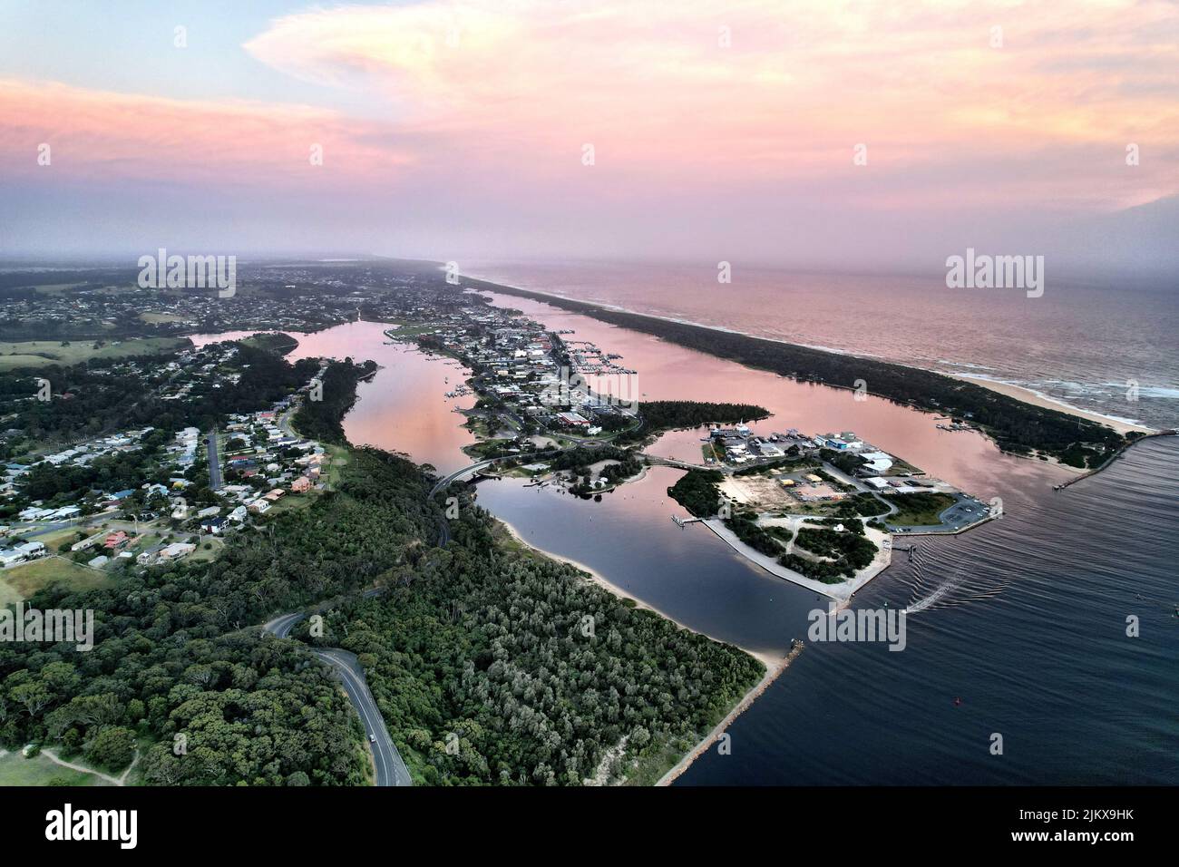 An aerial breathtaking view of buildings on a coral beach Stock Photo ...