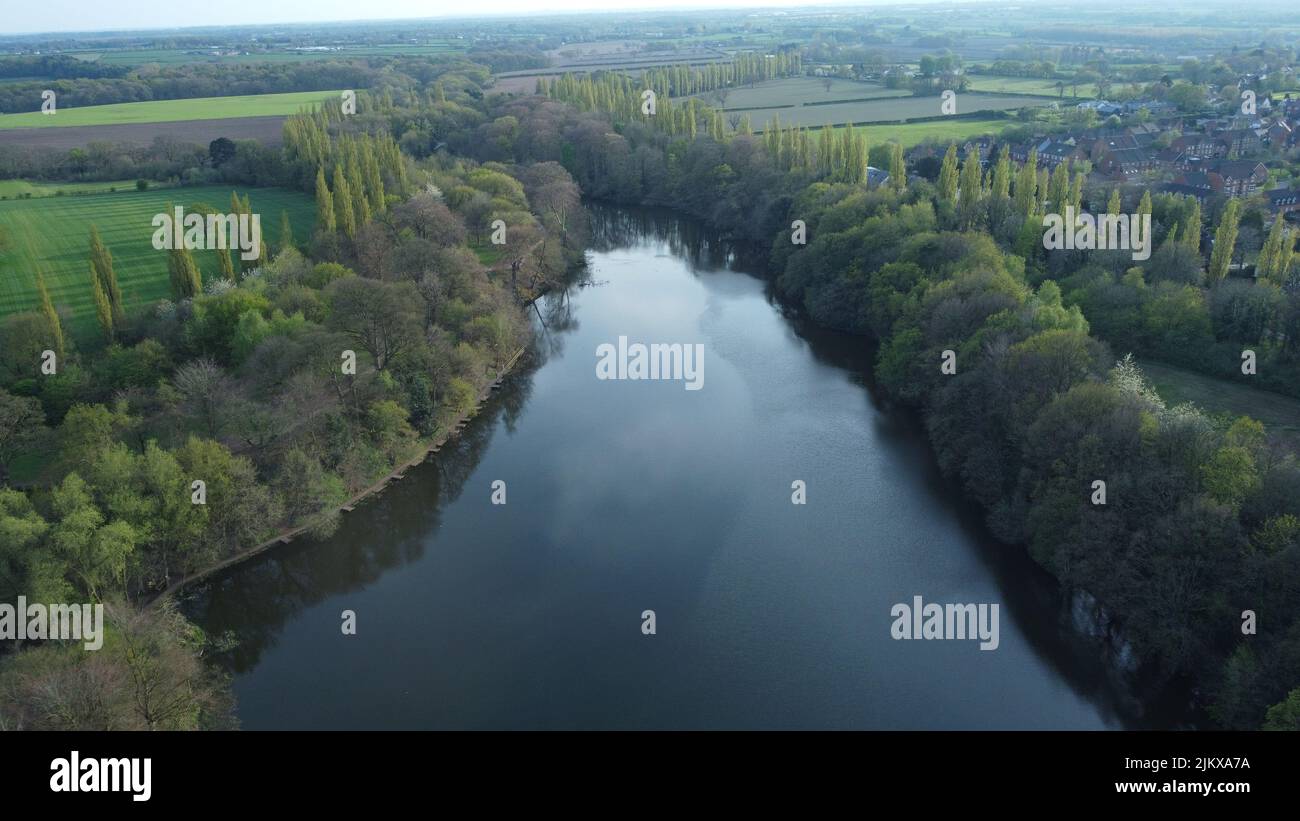 A bird's eye view of a river flowing through a landscape covered with ...
