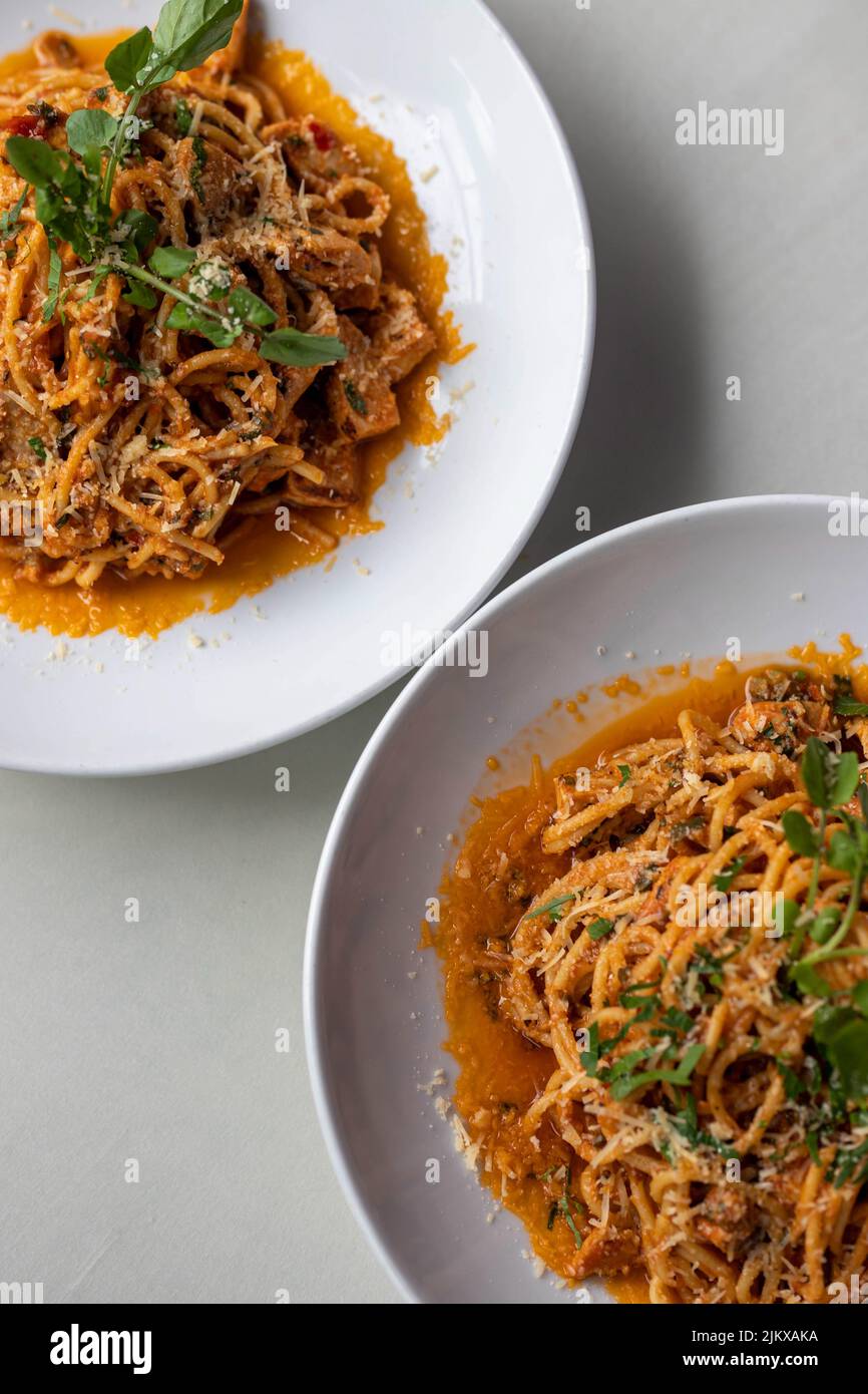 White pasta plates hi-res stock photography and images - Alamy