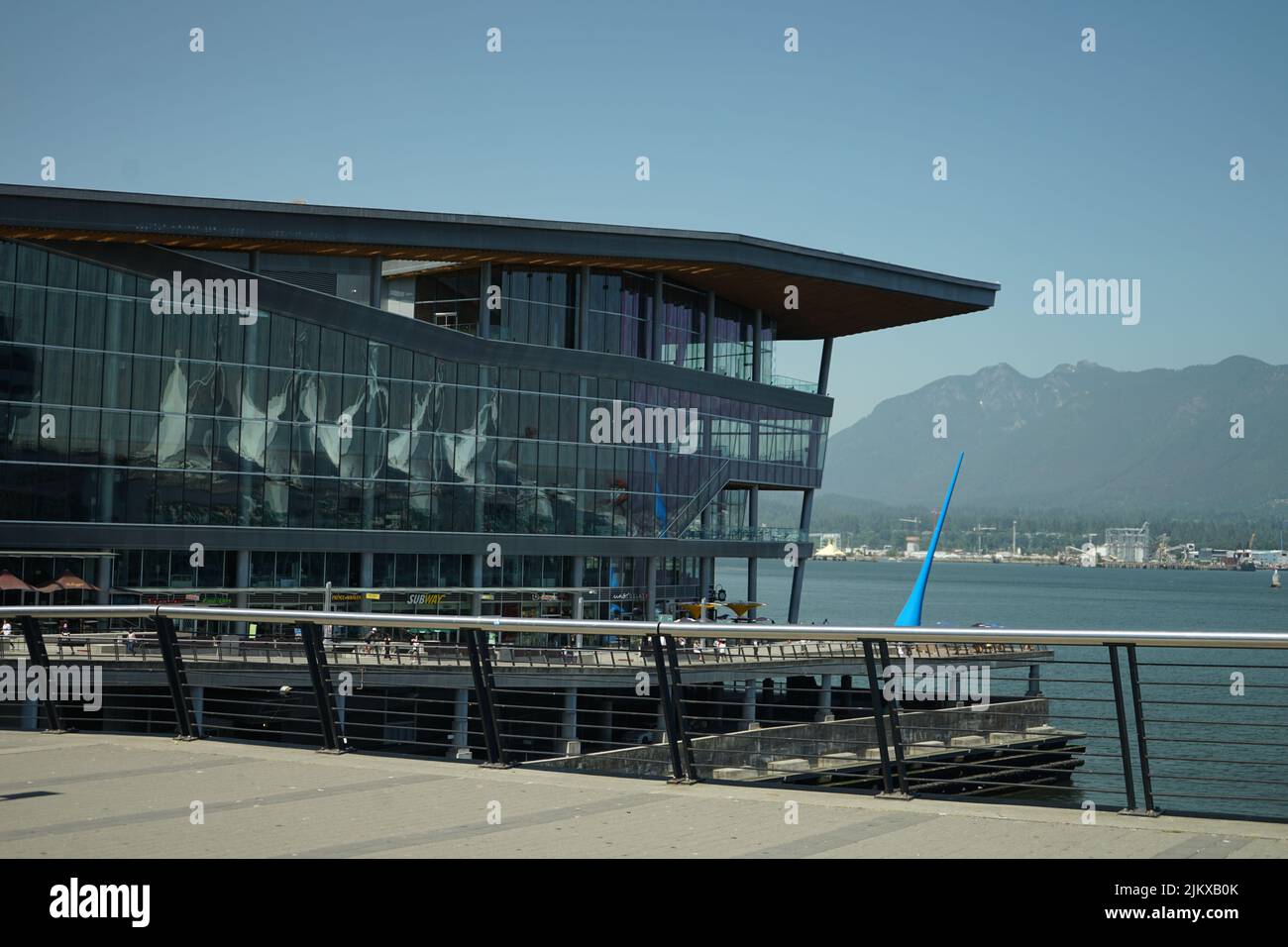 The Vancouver convention center with glass windows on the harbor in ...