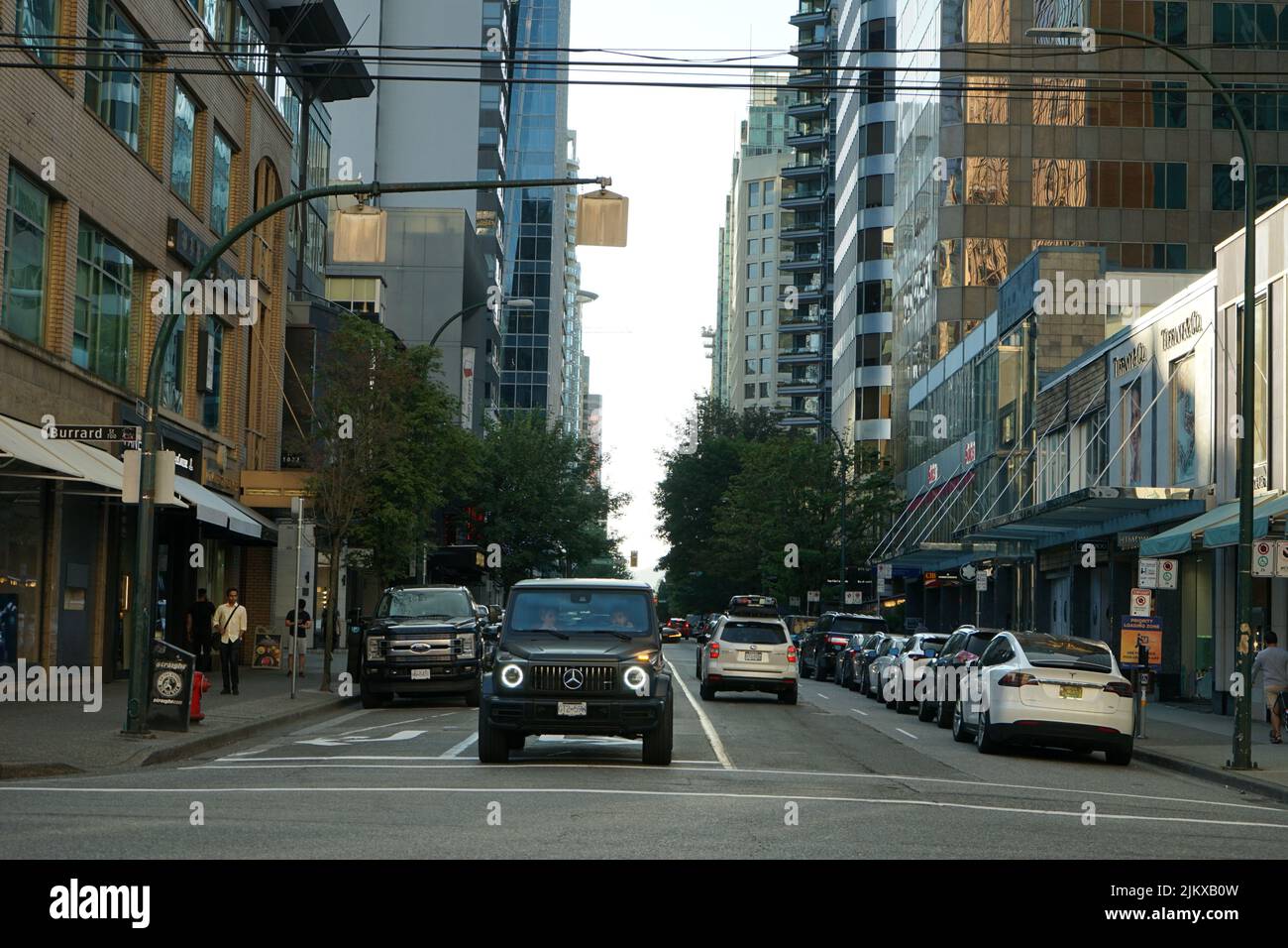 The downtown Vancouver with busy streets and modern cars, tall ...