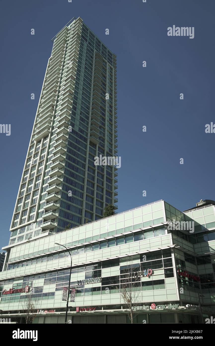 A vertical low angle view of a tall modern building in downtown ...