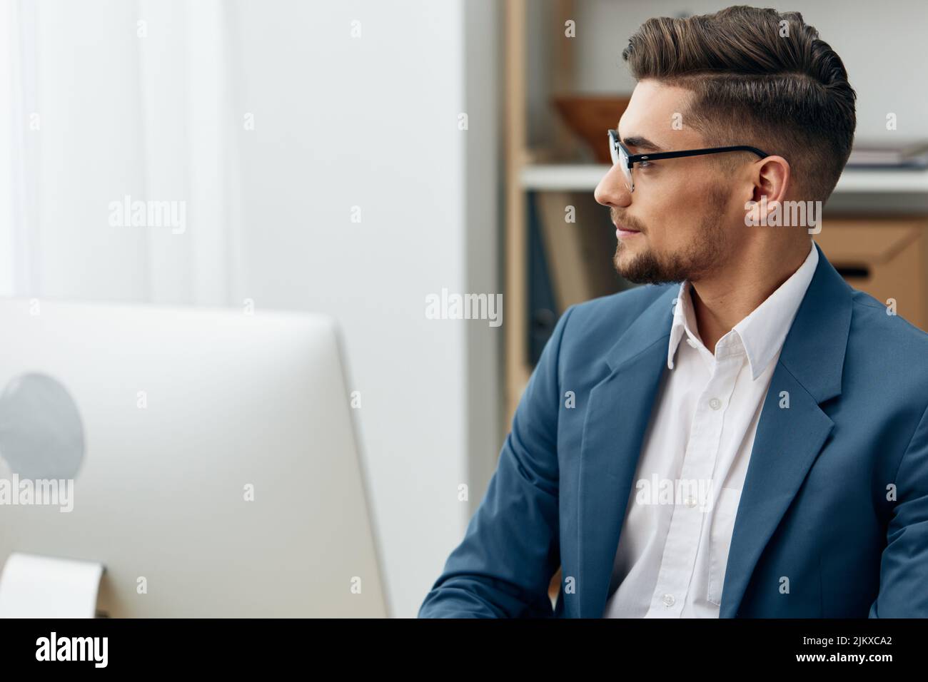 handsome businessman sitting at the computer work boss workplace Stock ...