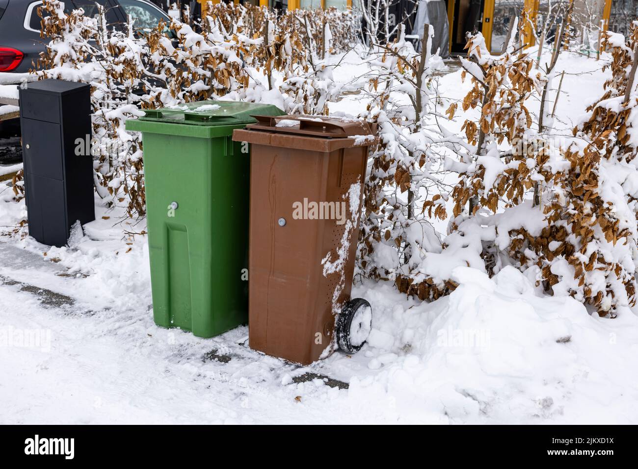 Close up view of house mail post box and waste and recycling containers ...