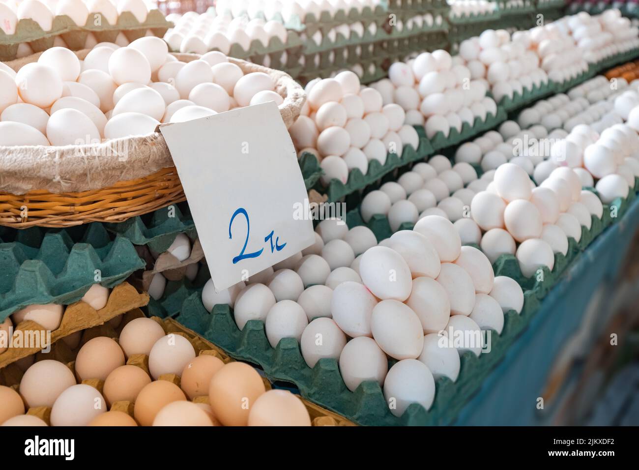 A lot of eggs are selling at the farmers rural market. Price tag - 2 ...