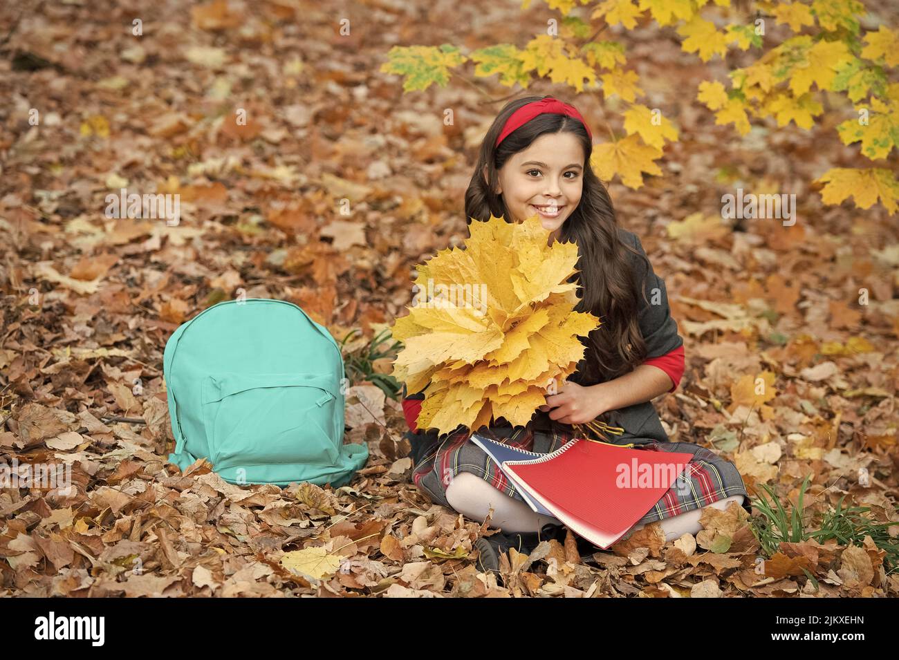 childhood happiness. back to school. kid with notebook. fall season ...