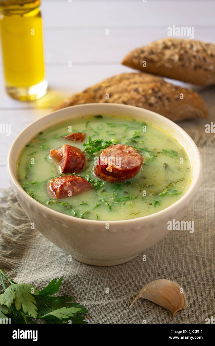 Portuguese Cabbage soup called Caldo Verde on white table Stock Photo ...