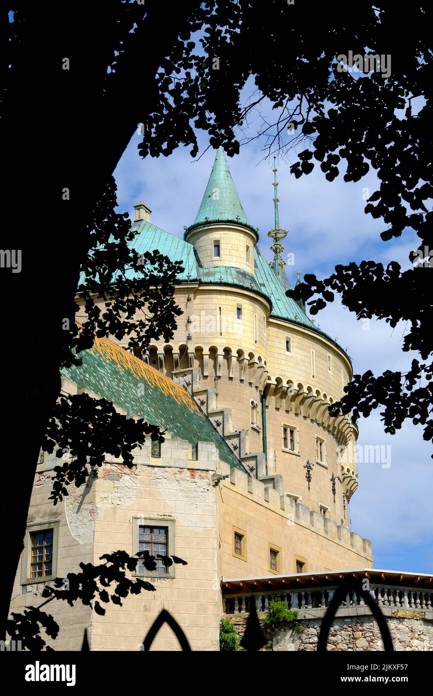 A vertical shot of the Bojnice Castle with blue domes in Slovakia from ...