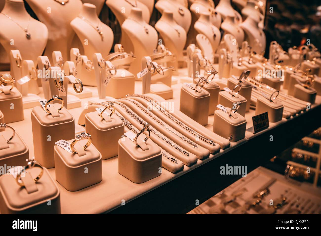 jewelry - rings and bracelets on the shop window. The concept of ...