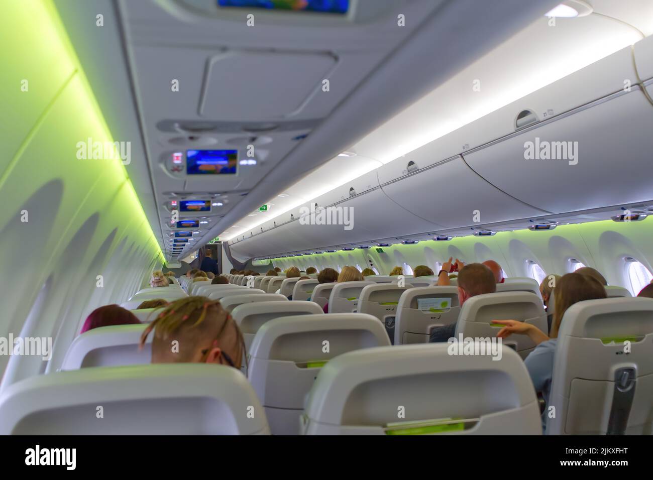 Passengers traveling by plane, inside of an airplane Stock Photo - Alamy
