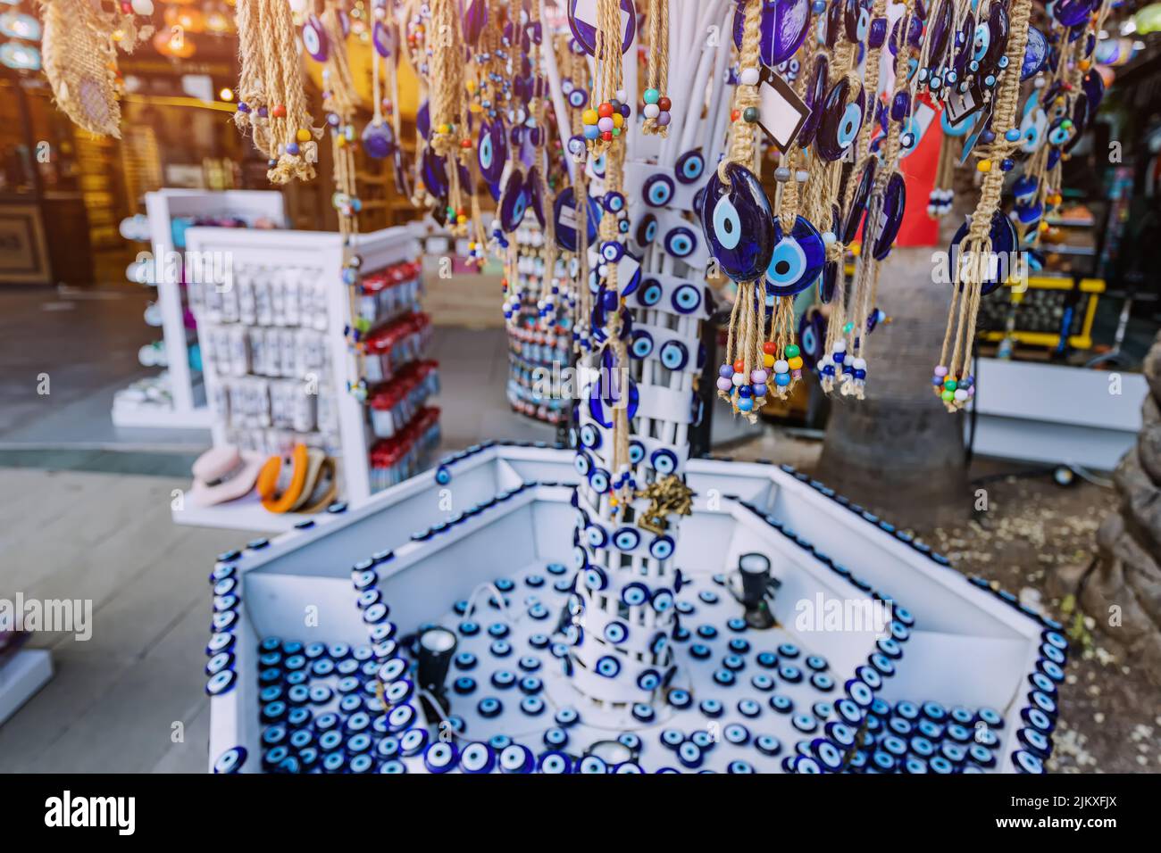 Evil eye turkish bead amulets hanging in souvenir store. Gift and ...