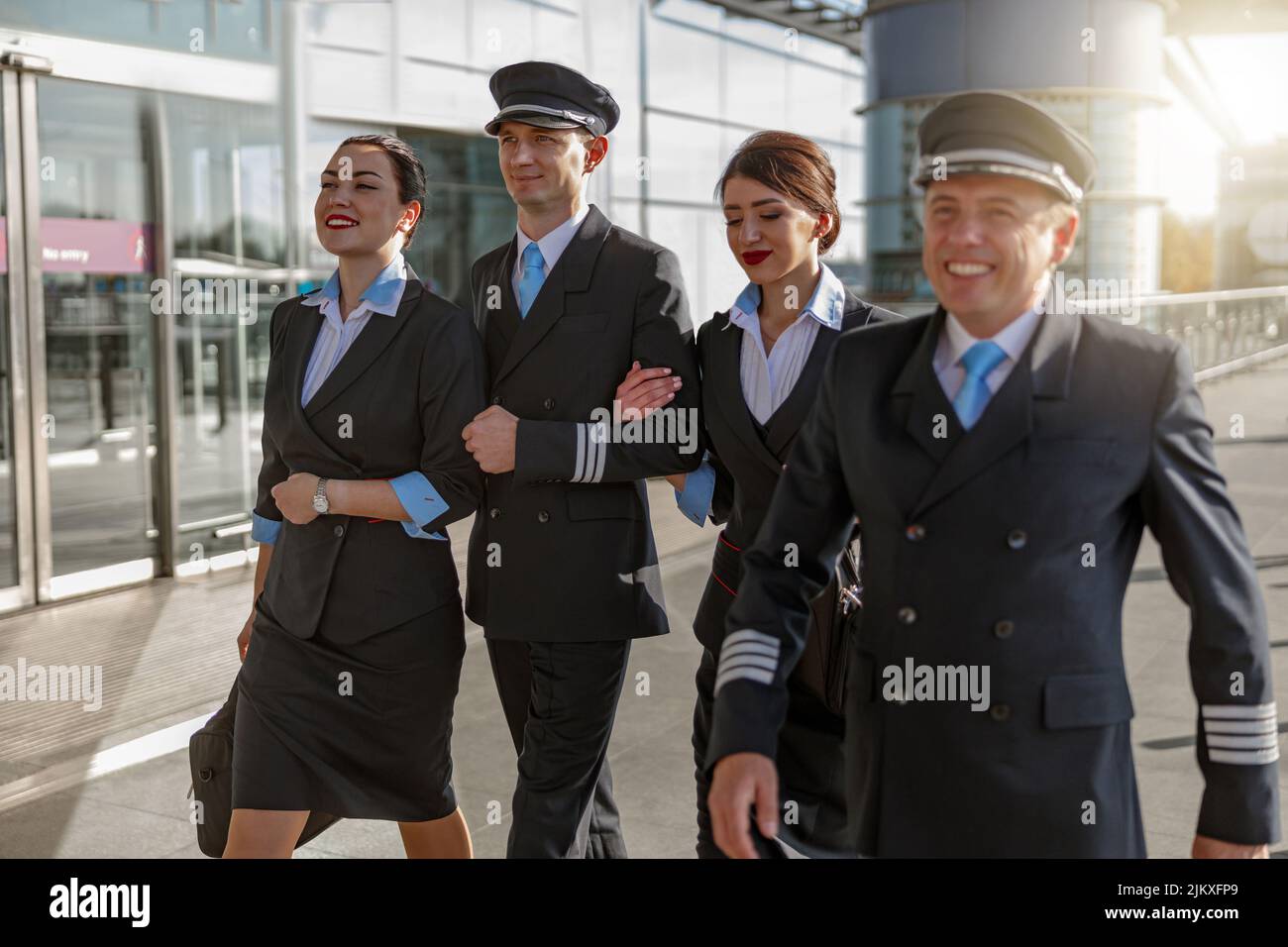 Pilot flight attendants walking airport hi-res stock photography and ...