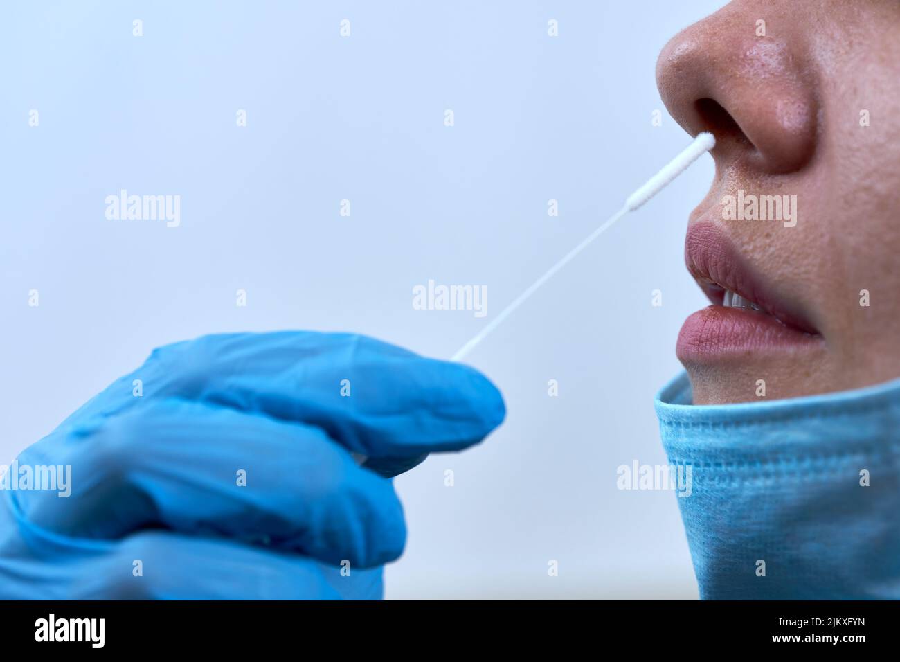 Taking coronavirus nasal swab test in clinic Stock Photo - Alamy