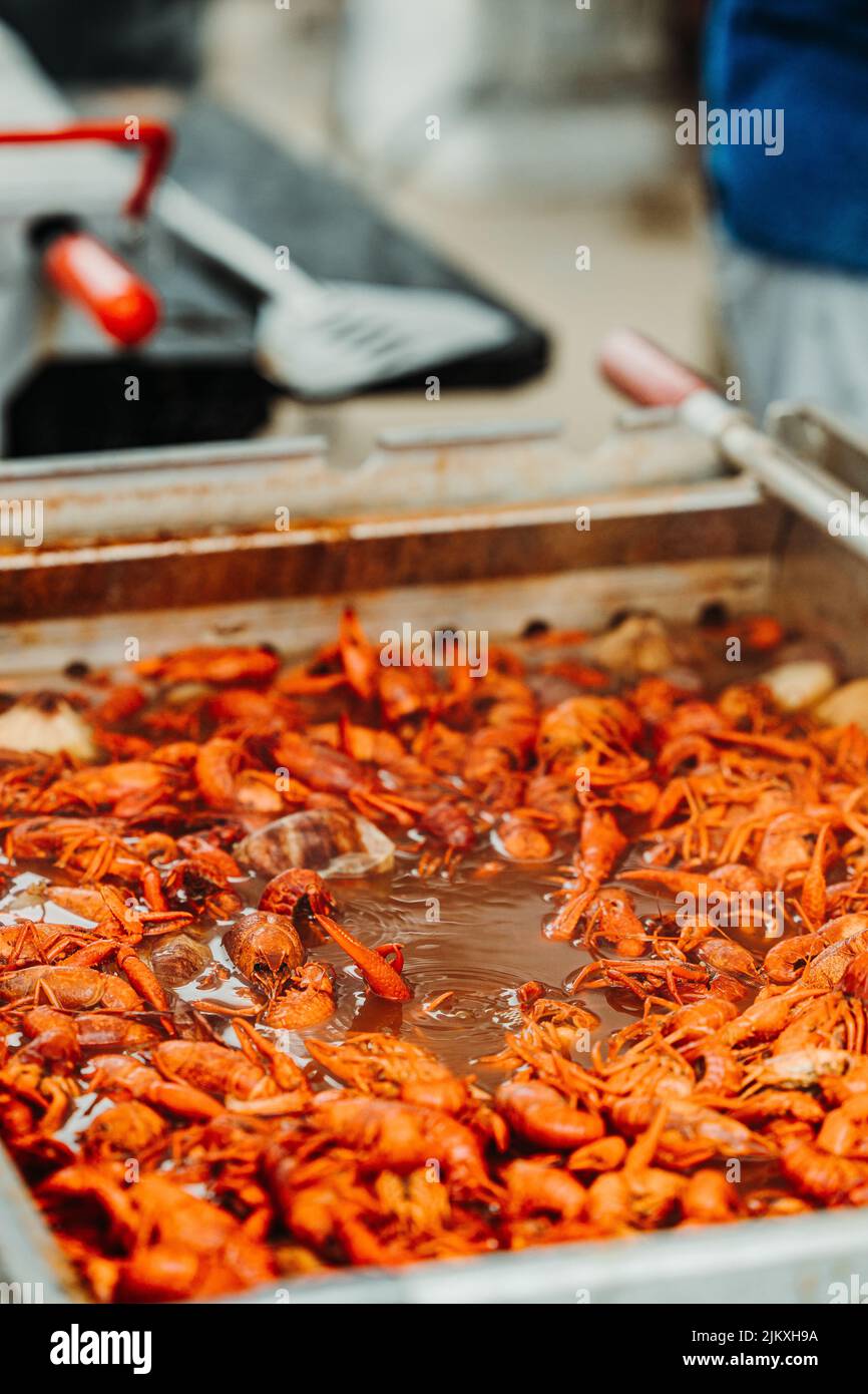 A vertical closeup of a box of fresh crawfish in a market Stock Photo ...