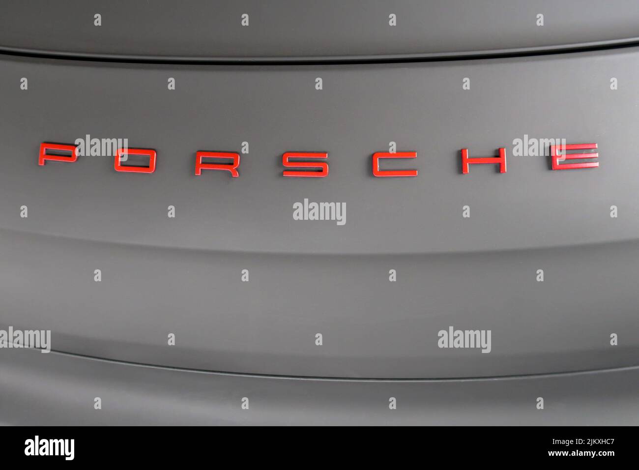 March 29 2022, Kiel, Germany, red porsche lettering on grey car paint ...