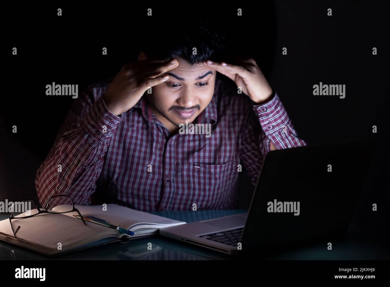 frustrated business man feeling tensed and headache while working on ...