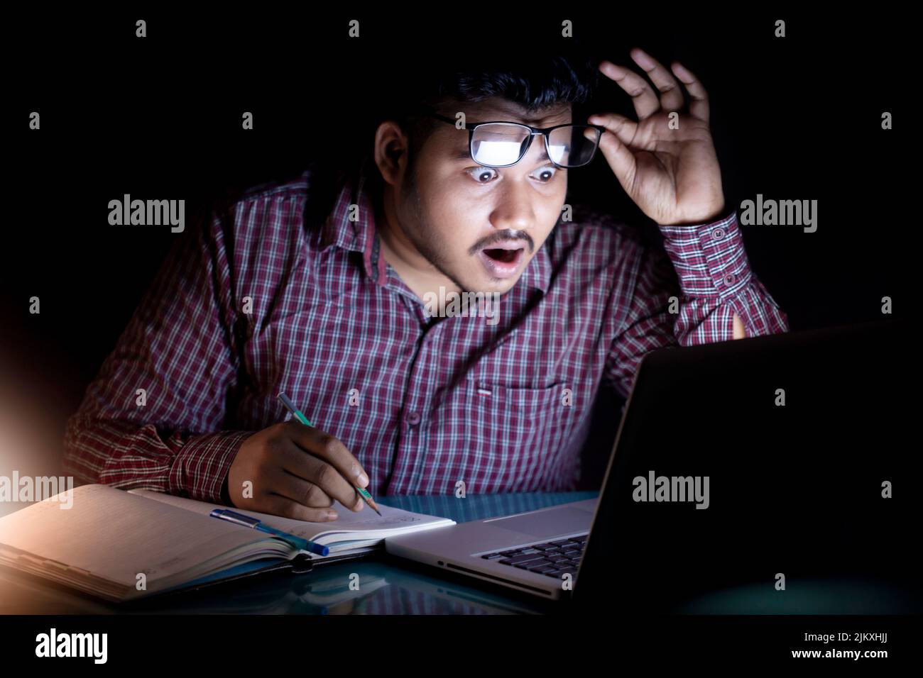 corporate man shocking expression after looking at laptop screen at ...