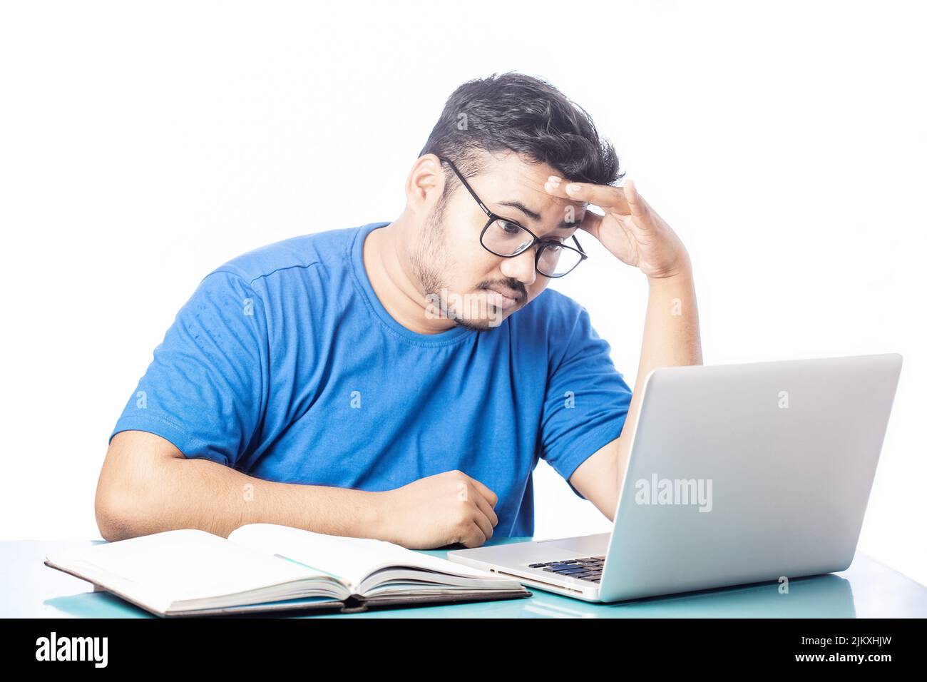young man feeling exhausted by working on laptop, man got headache ...