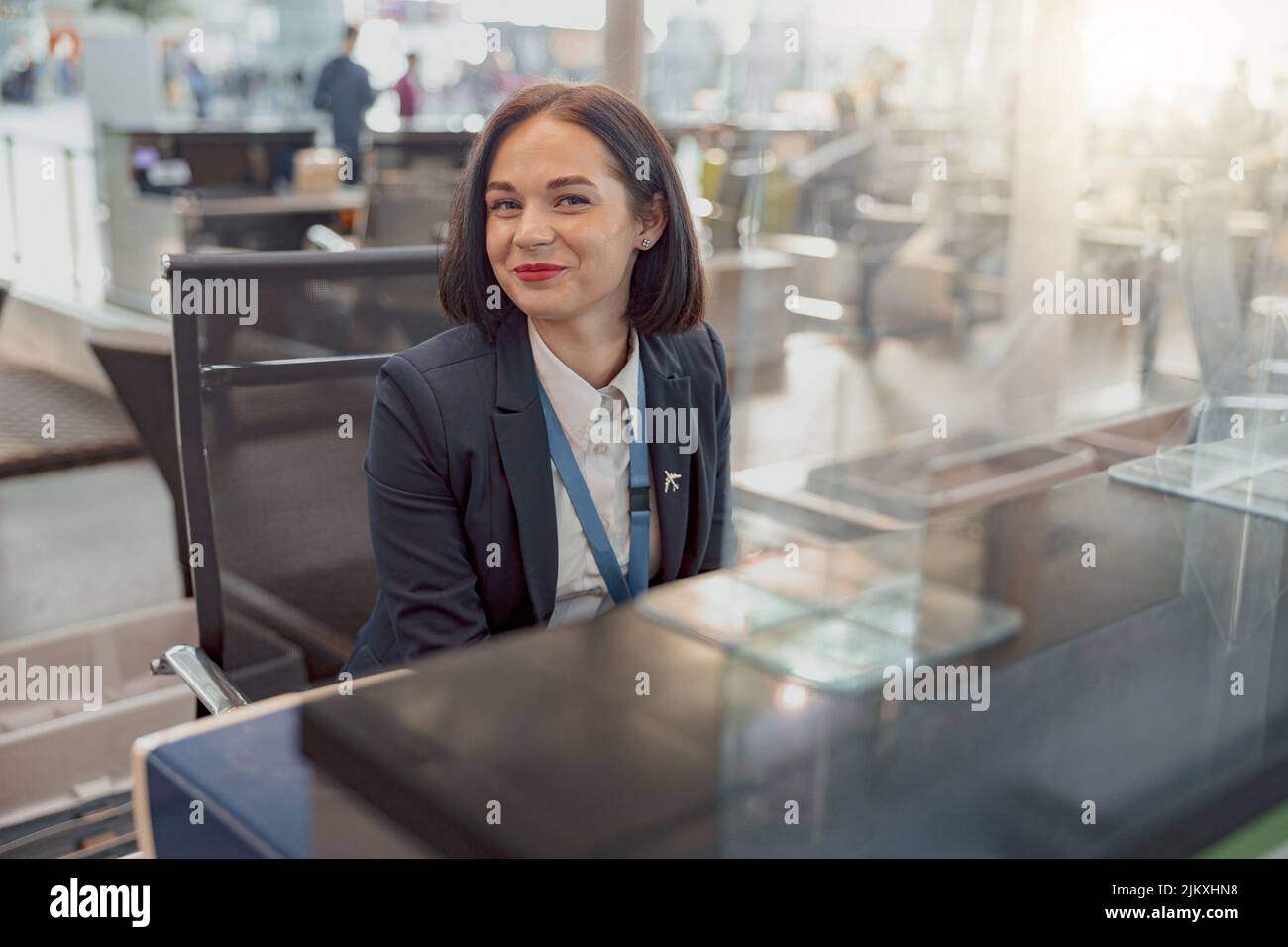 Smiling female employee of the passport control department Stock Photo ...