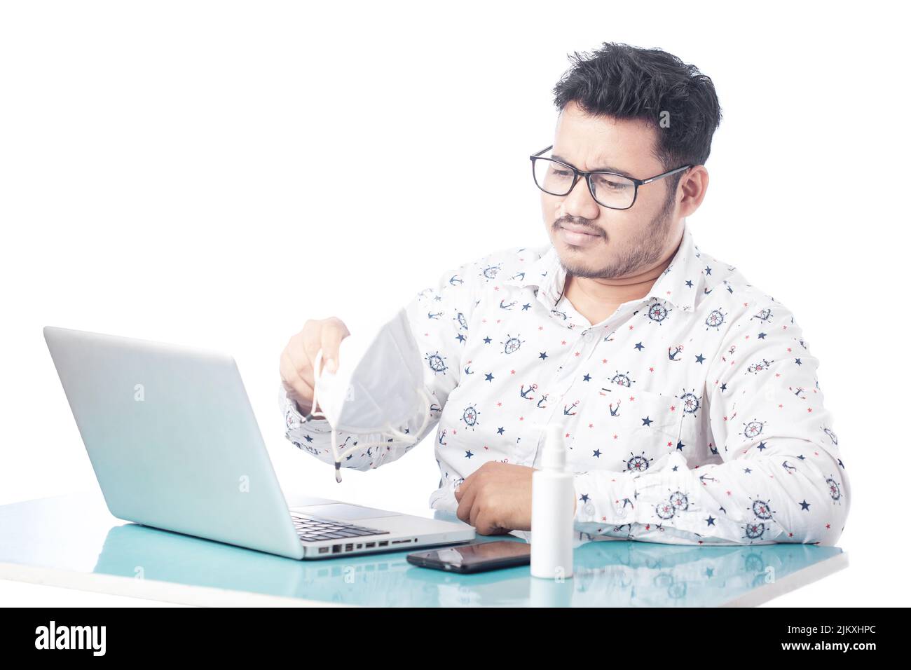 frustrated man hate to wear mask while using laptop Stock Photo - Alamy