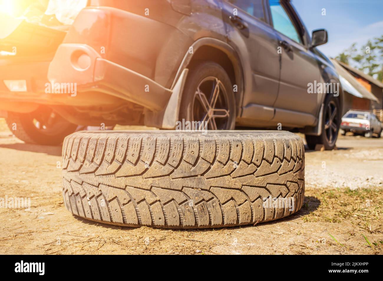 concept of replacing a spare wheel on the road with your own hands. The ...