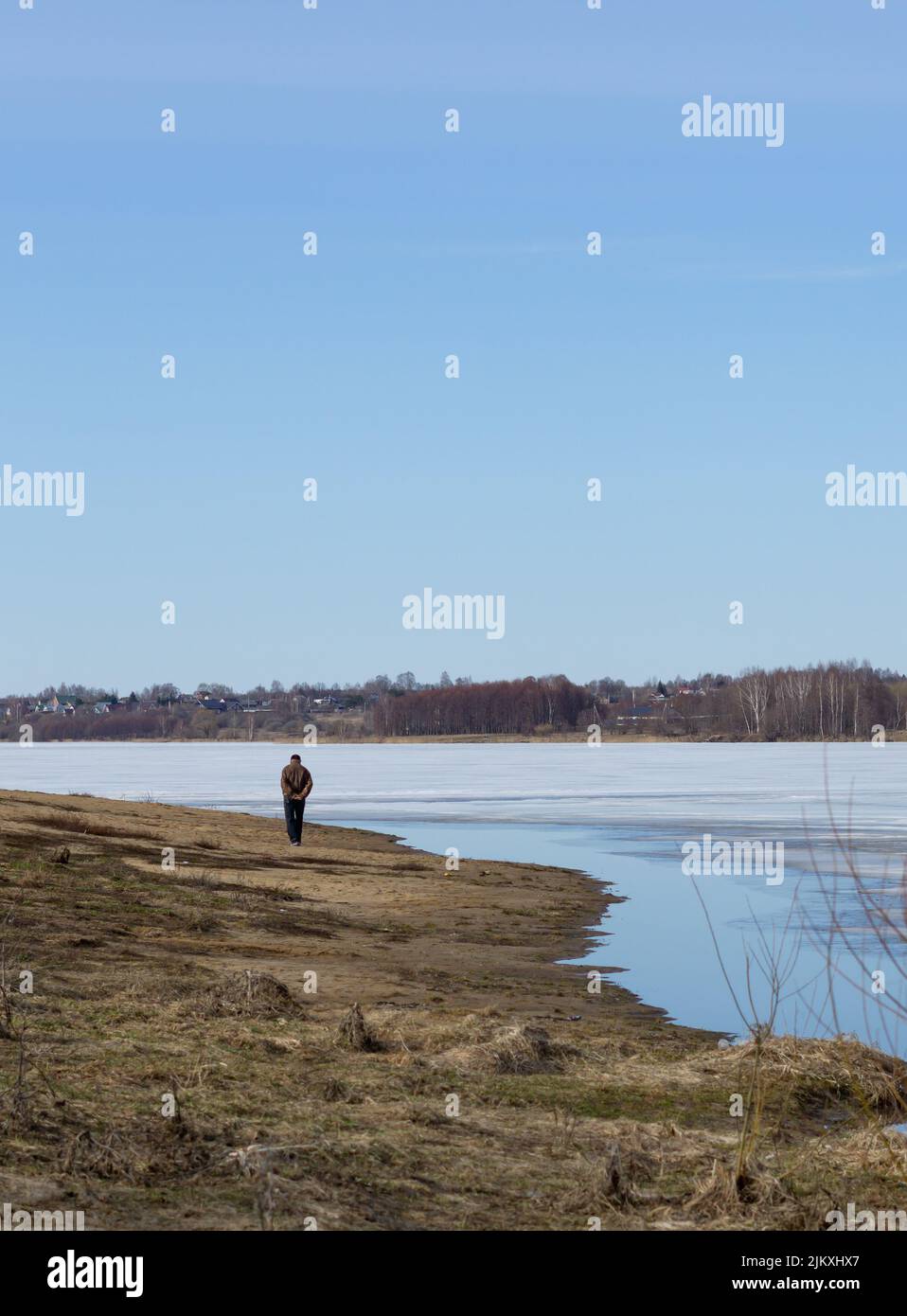beautiful place, unknown man looking at nothing in a lake Stock Photo ...