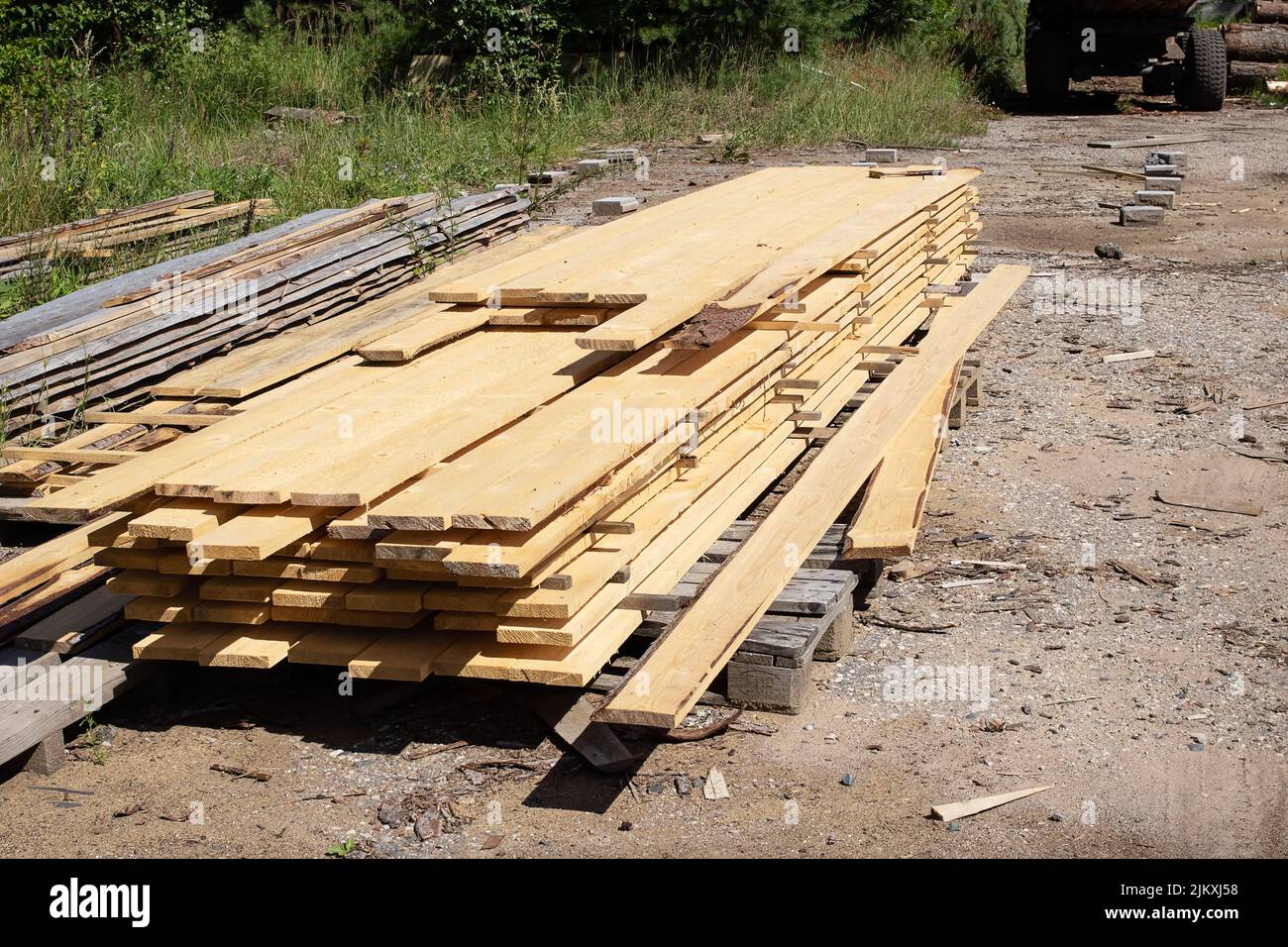 Folded finished boards at the sawmill close up Stock Photo - Alamy