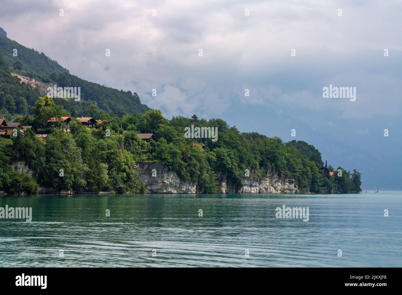 The beautiful view of Lake Brienz against the background of green ...