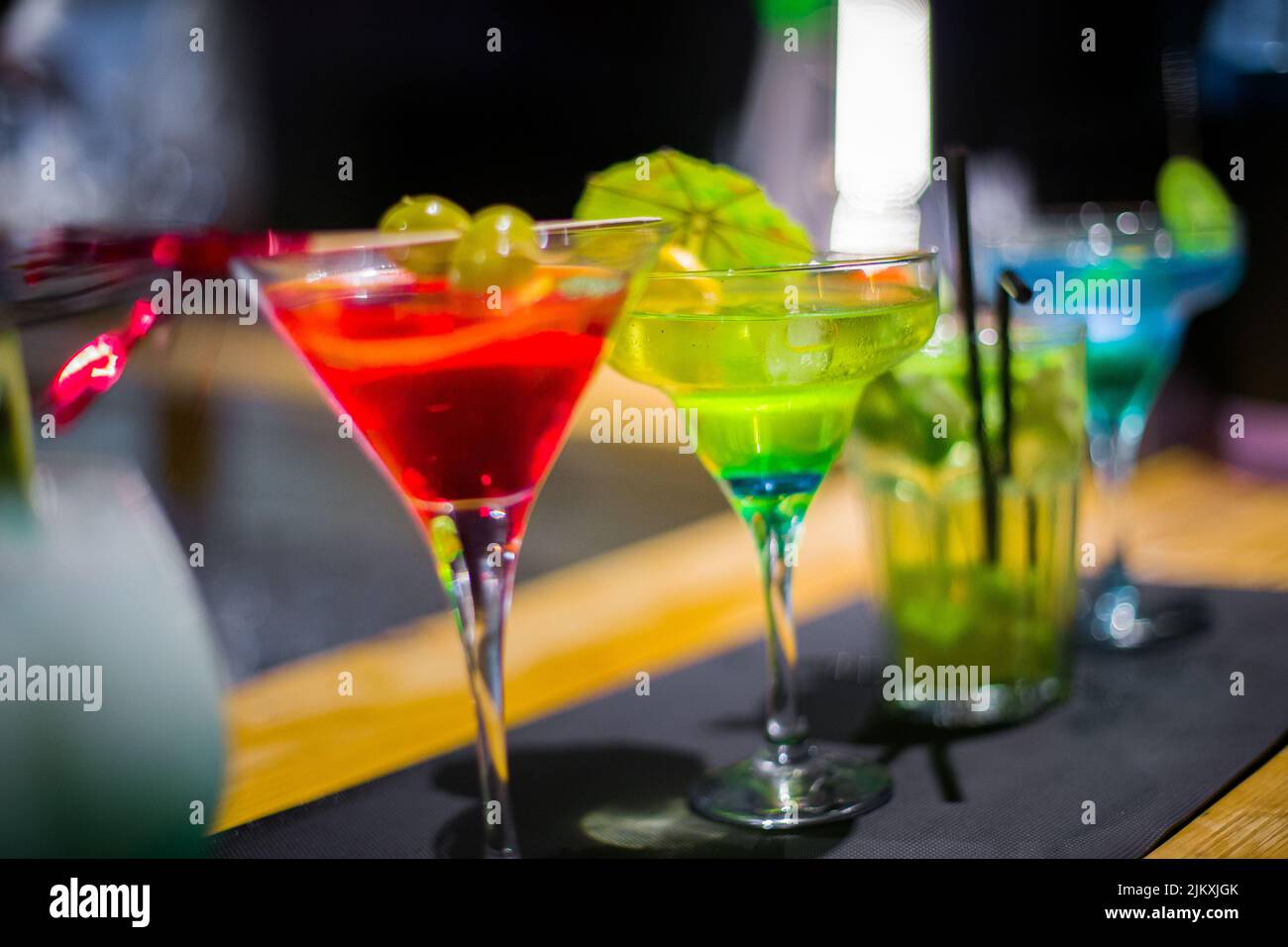 Row of different martini glasses on the counter in a bar Stock Photo ...