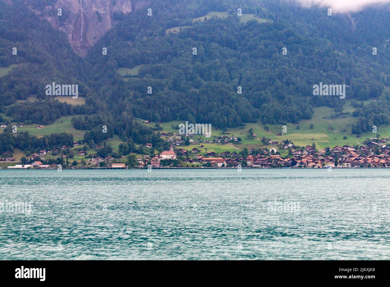 The beautiful view of Lake Brienz and the small town on the mountain ...