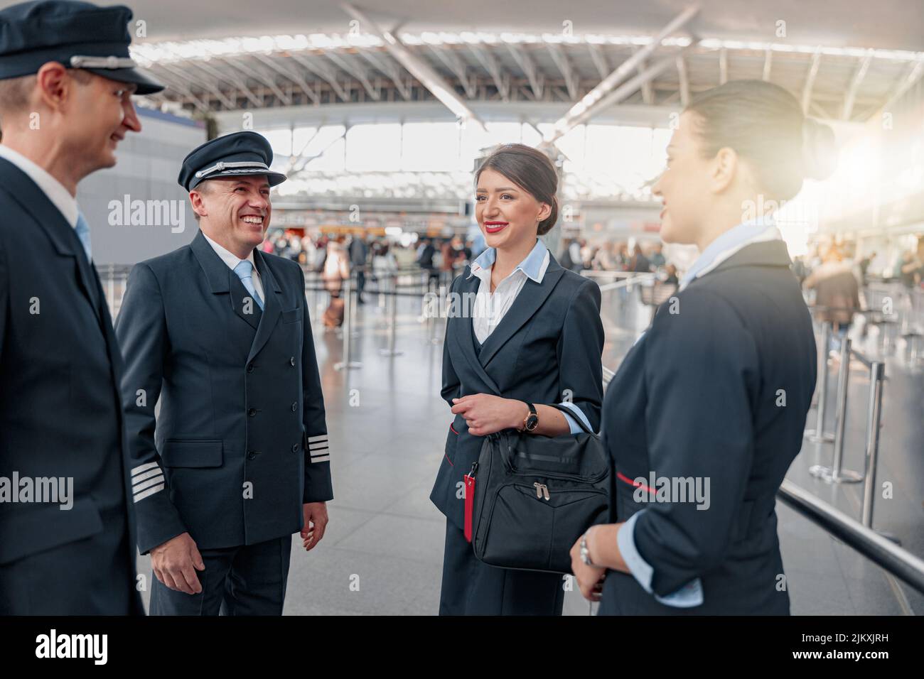 Two pilots communicating with flight attendants before the flight Stock ...