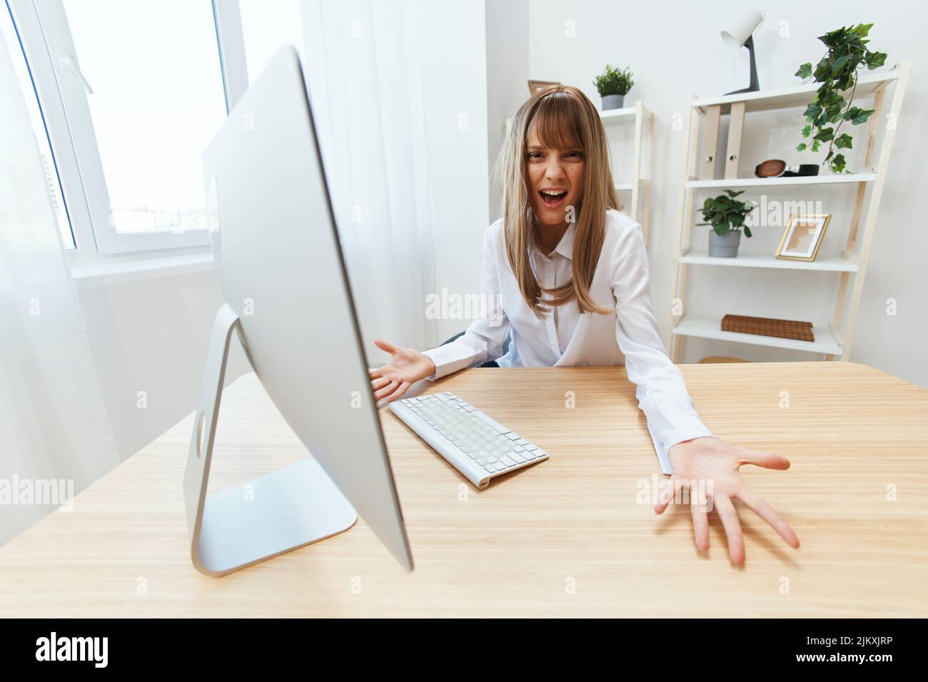 Irritated evil blonde businesswoman confused after computer software ...