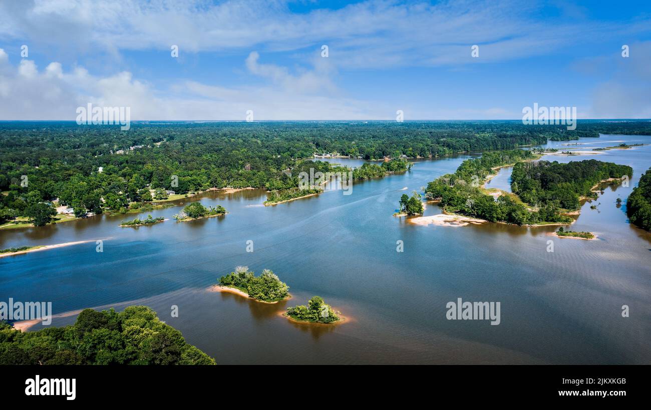 An aerial view of a lake with green landscapes in Houston, Texas Stock ...
