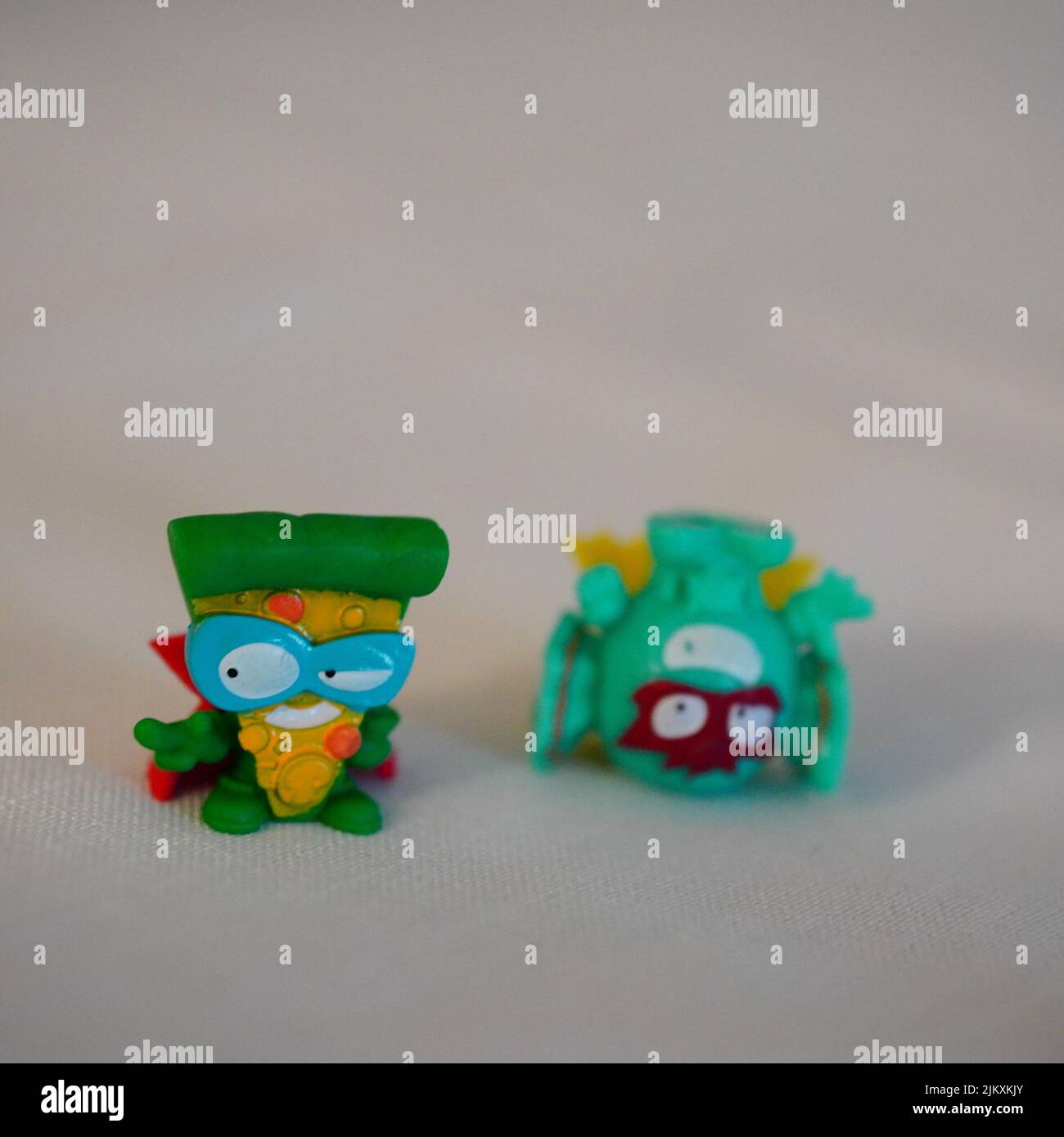 Two Magic Box brand Super Things toy figurines, including pizza-shaped ...