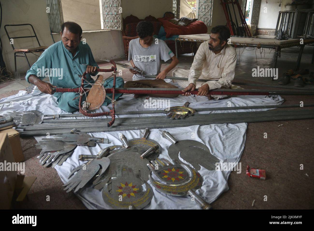 Pakistani shiite women busy in making Tazia Azadari items at Azakhana ...