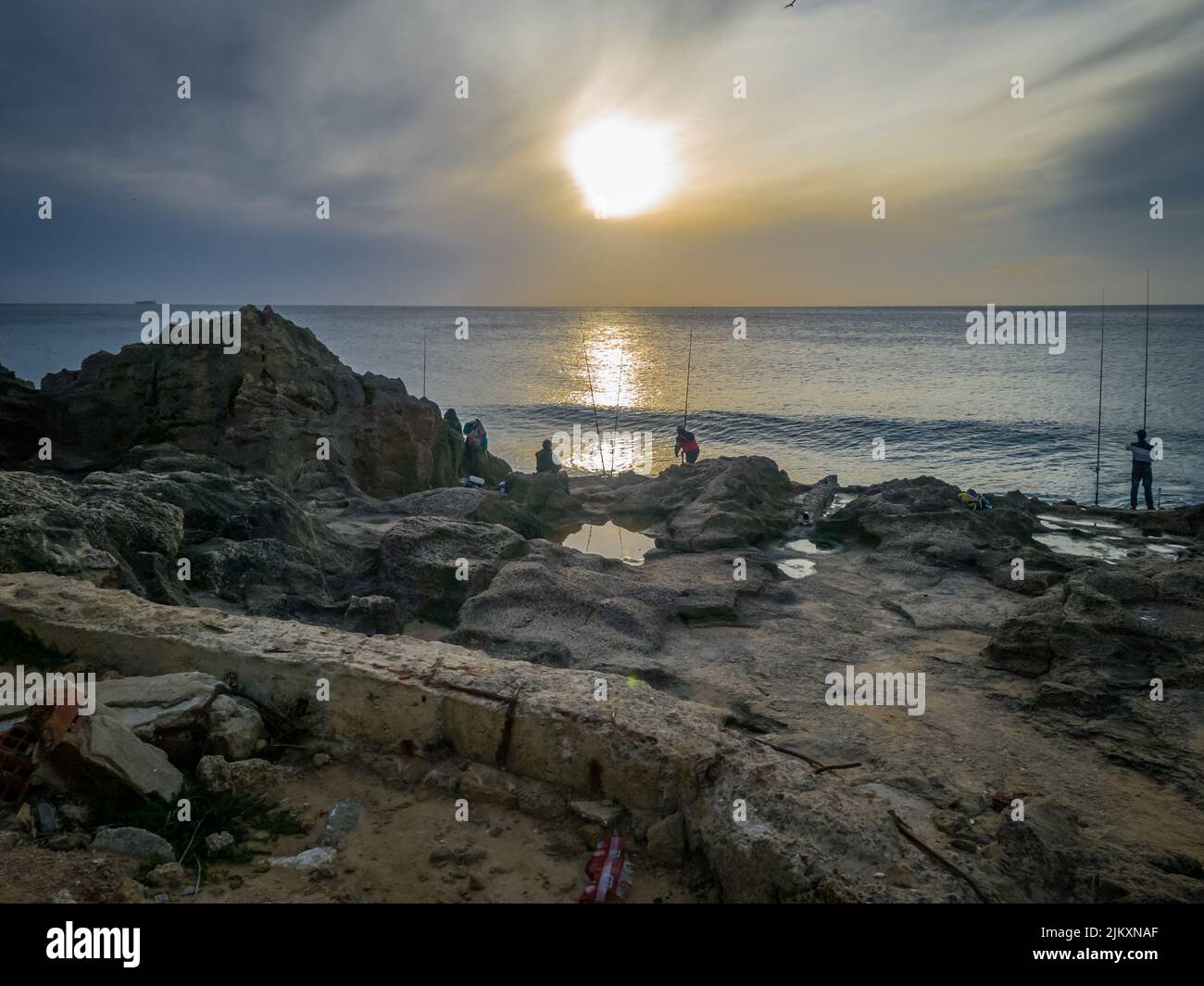 The rocky coast of Tangier at sunset Stock Photo - Alamy