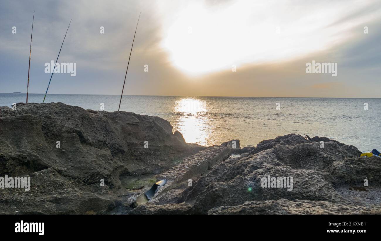 The rocky coast of Tangier at sunset Stock Photo - Alamy