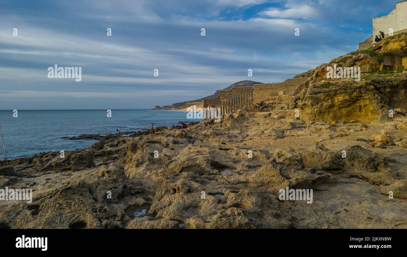 The rocky coast of Tangier at sunlight Stock Photo - Alamy