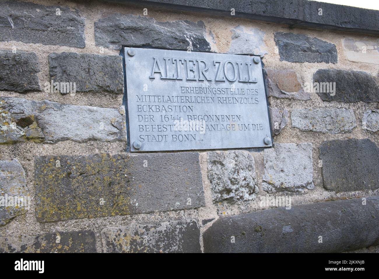 Rustic brick wall with the Alter Zoll sign, on the Rhine in the city of ...