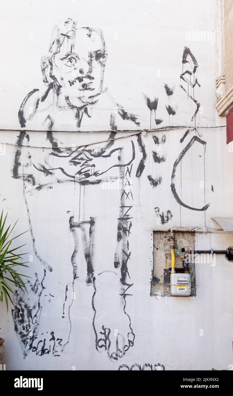 Mural by Naz Niyaz in black and white a man in Istanbul. Street art ...