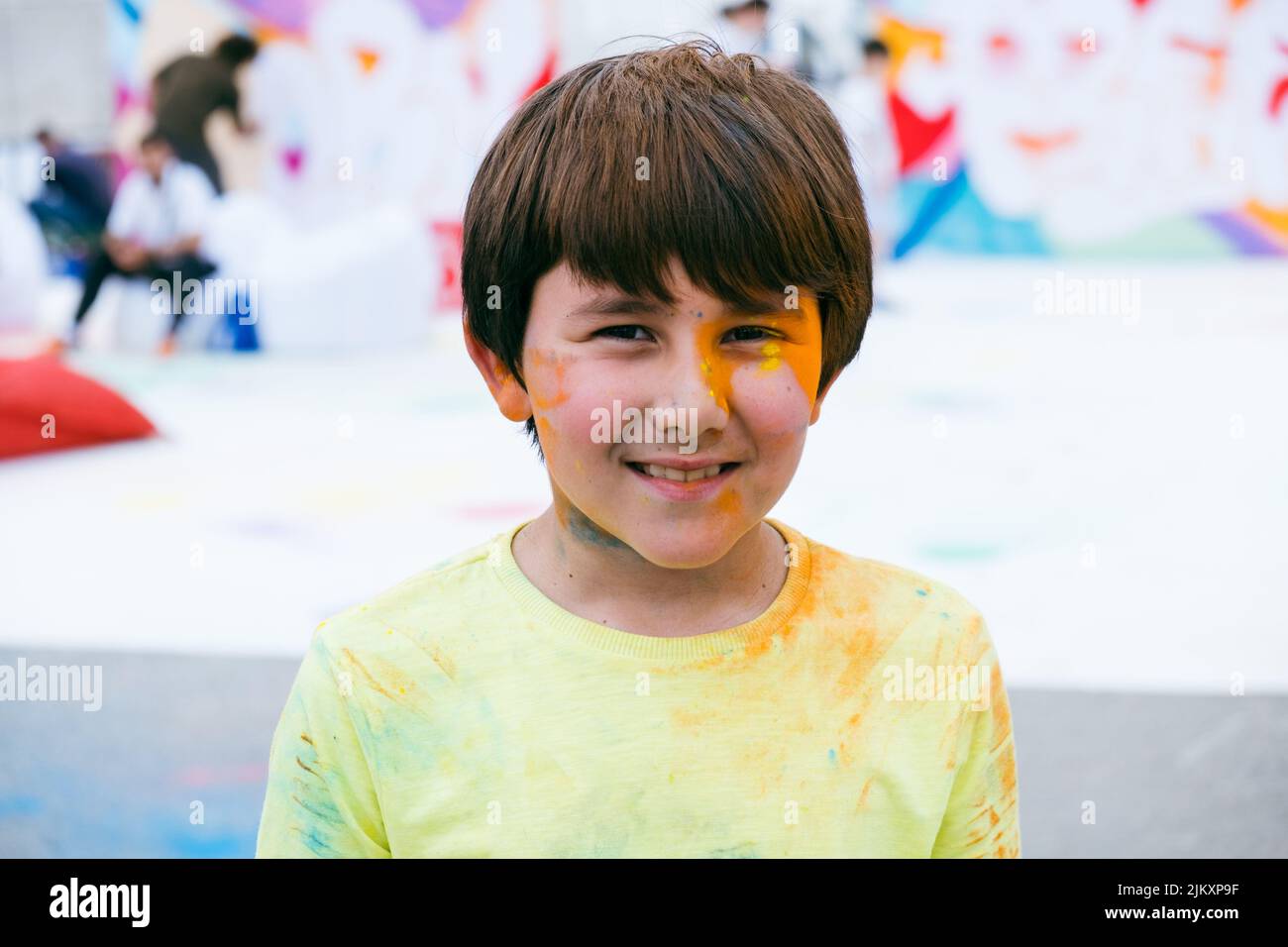 Holi festival. Young cheerful people under explosion of colored powder ...